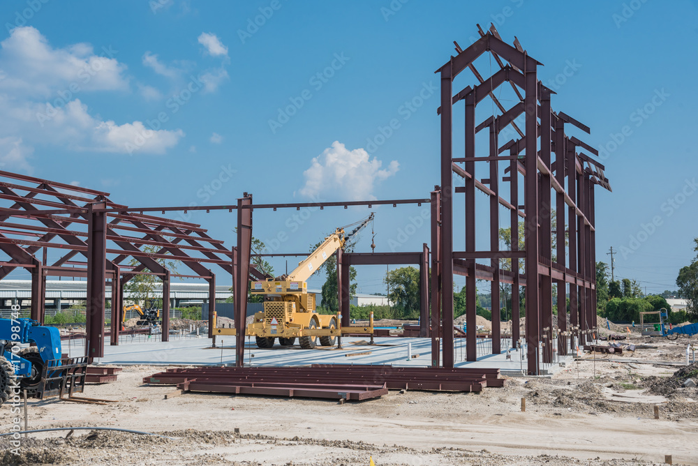 Steel structure of new industrial building under cloud blue sky. New ...