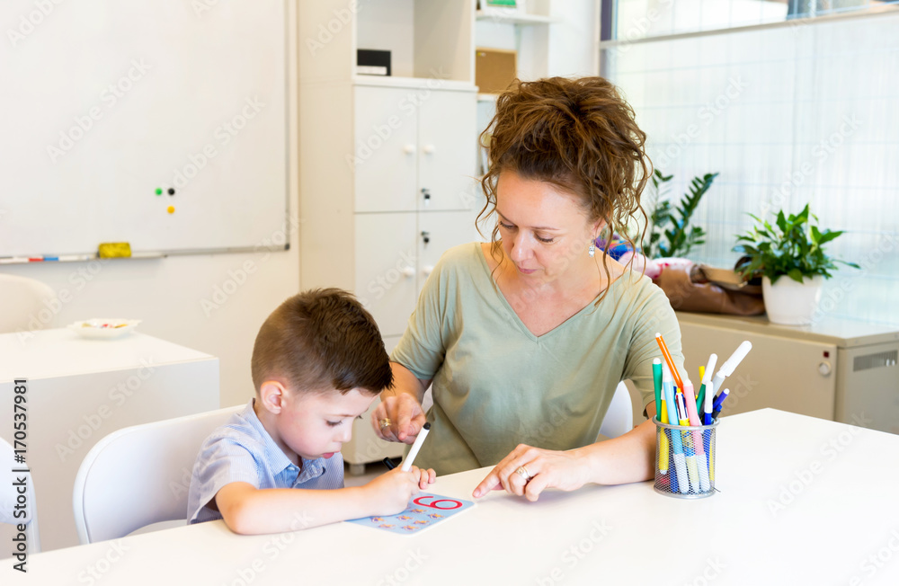 teacher woman learn to write character preschooler child boy, while ...