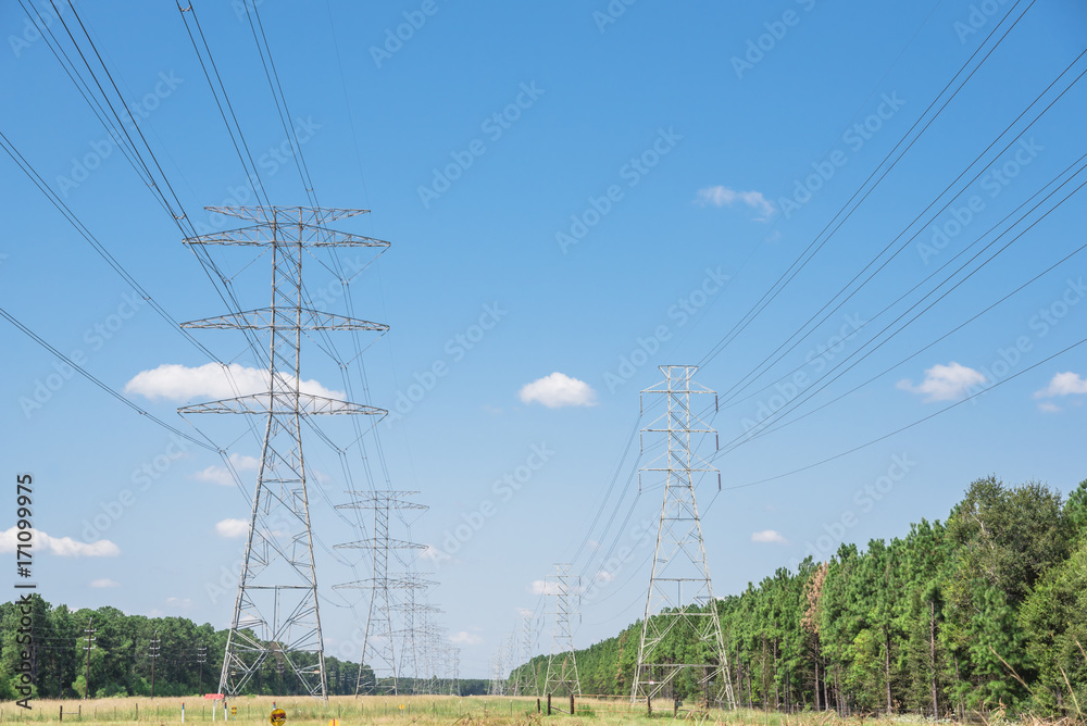 Parallel rows of transmission towers (power tower, electricity pylon ...