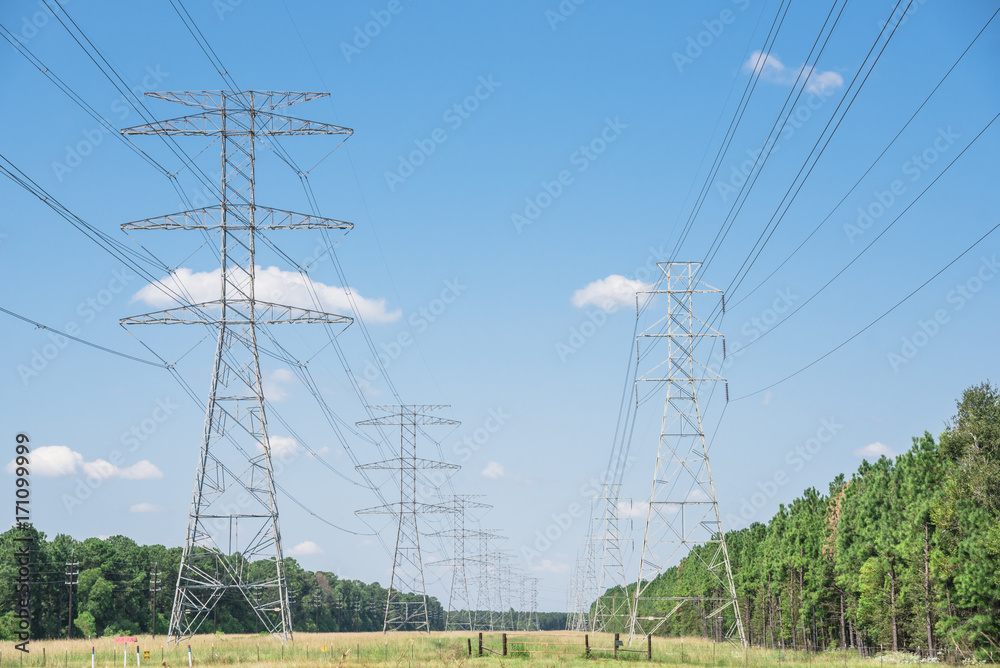 Parallel rows of transmission towers (power tower, electricity pylon ...