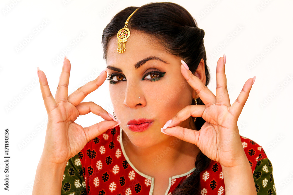 Woman dancing Indian dance in national dress. A beautiful girl portrait ...