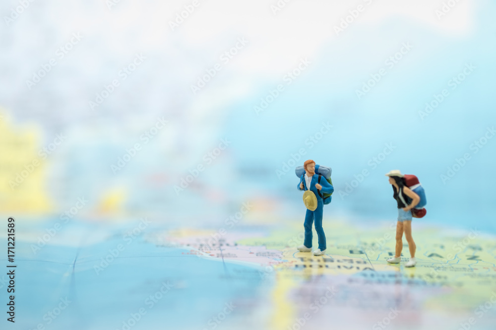 Travelling concepts. Two of traveler miniature mini figures with ...
