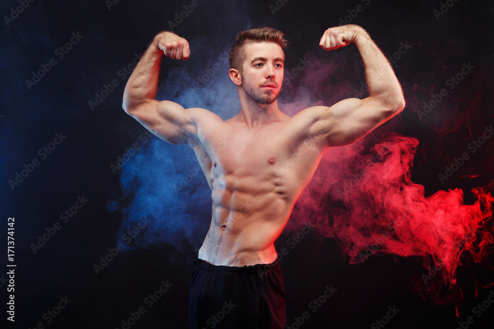 Young handsome muscular ripped man bodybuilder with perfect abs ...