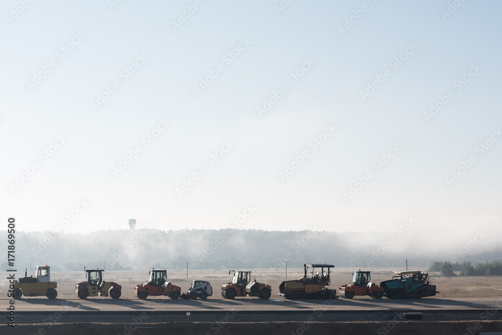 road under construction - wheel loader machine, pneumatic tyred roller ...