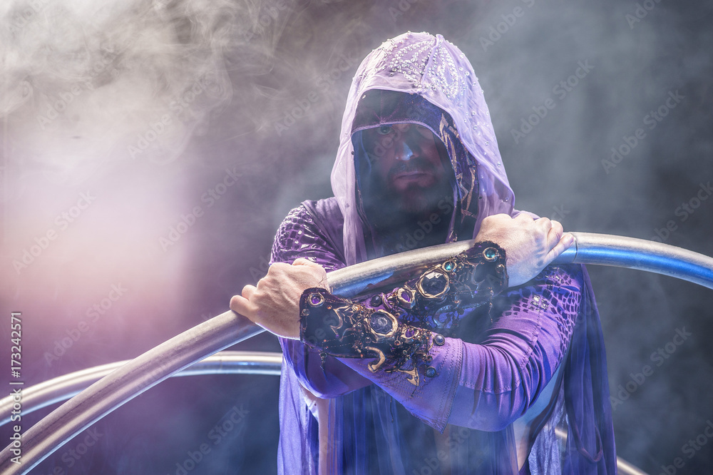 Foto de Stock Assassin. Fairy-tale character in a bright purple suit ...