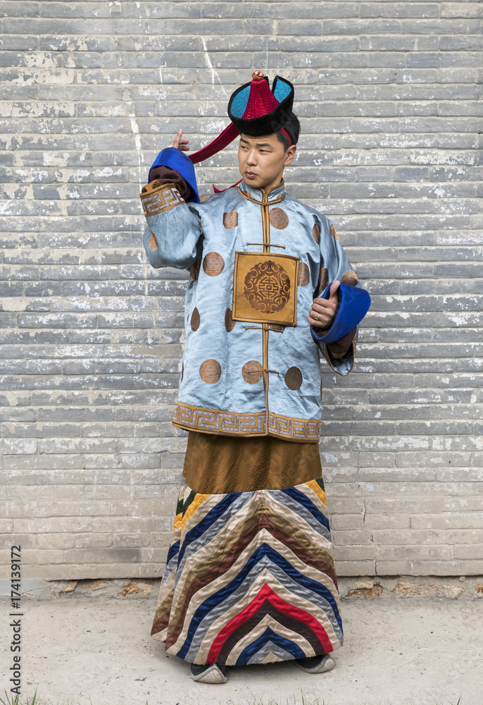 Mongolian man in traditional 13th century style outfit in a temple in ...