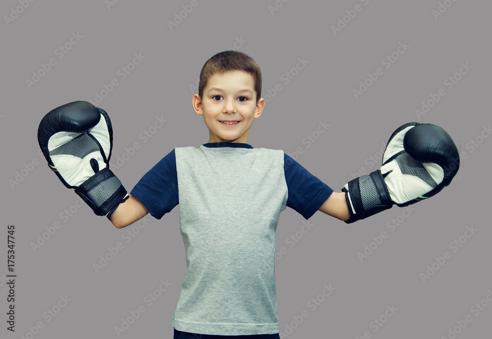 Boy boxer. Portrait of a cute sporty boy in boxing gloves. Boy in black ...