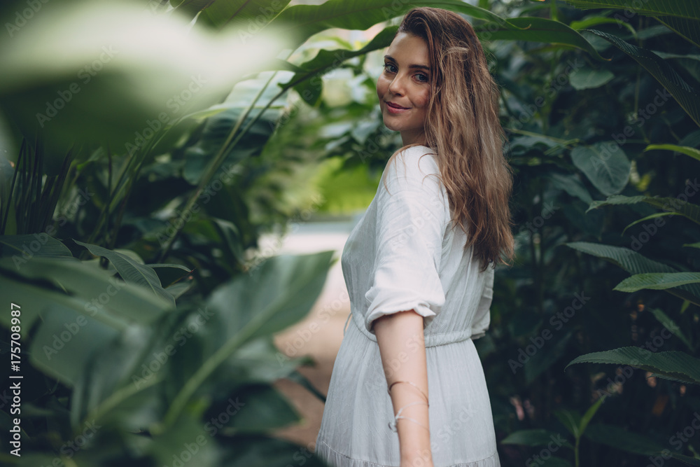 Beautiful female model in greenhouse Stock Photo | Adobe Stock