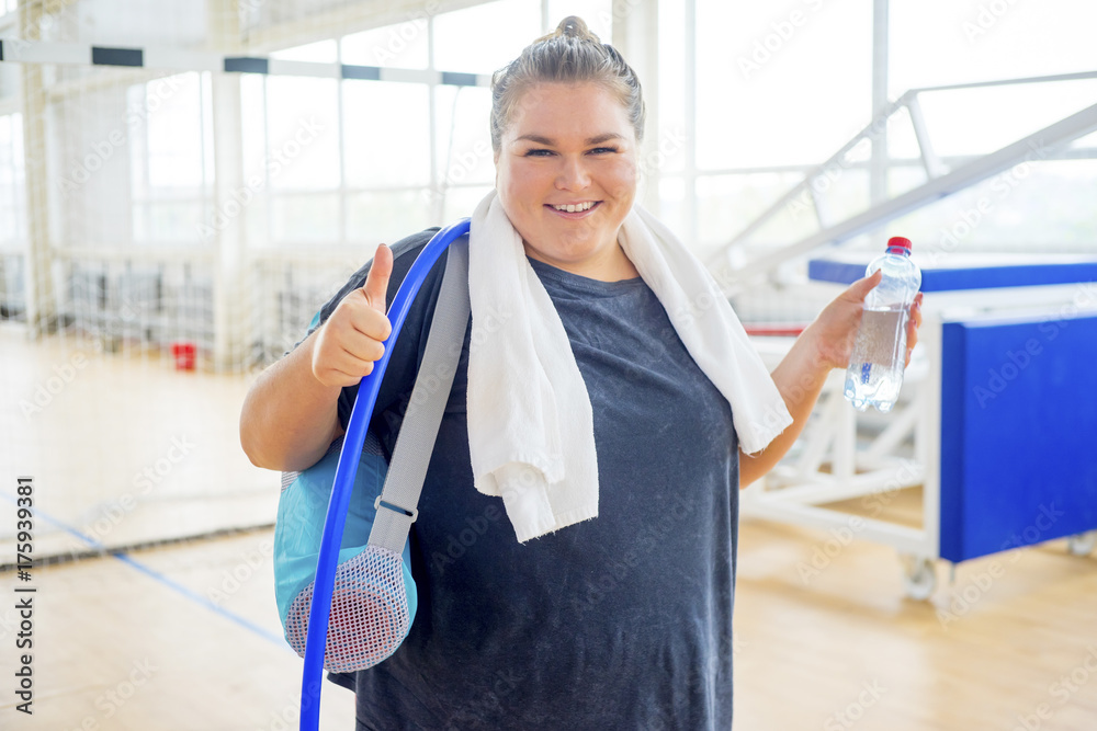 Fat girl in a gym Stock Photo | Adobe Stock