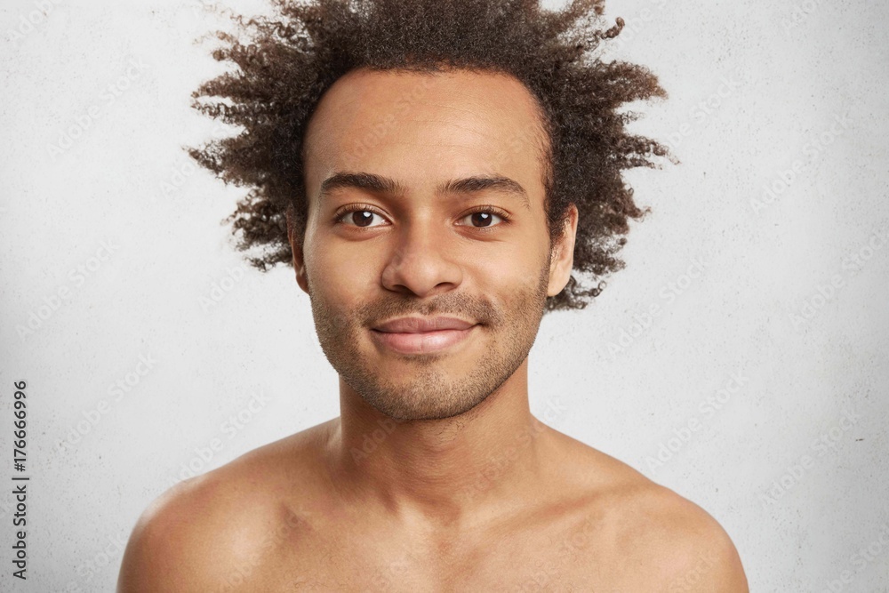 Close up portrait of condifent dark skinned male with bristle has crisp ...