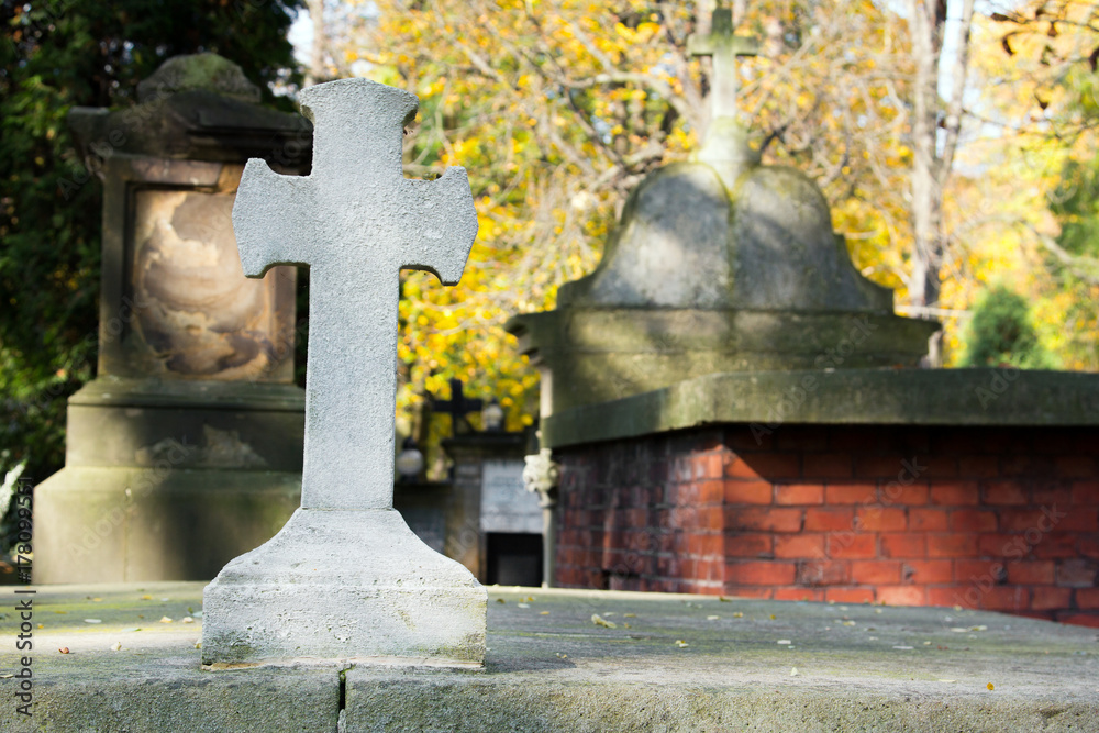 Old stone memorial cross at cemetery. Religious Christian symbol on ...