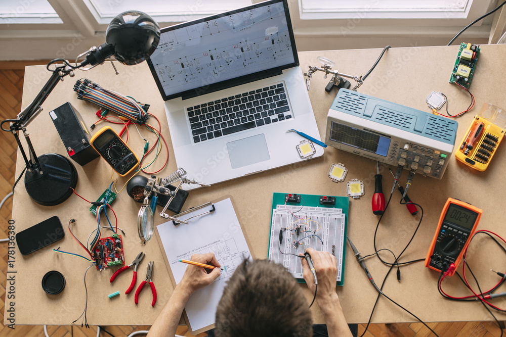 Engineer Testing Electronic Equipment at Home Stock Photo | Adobe Stock