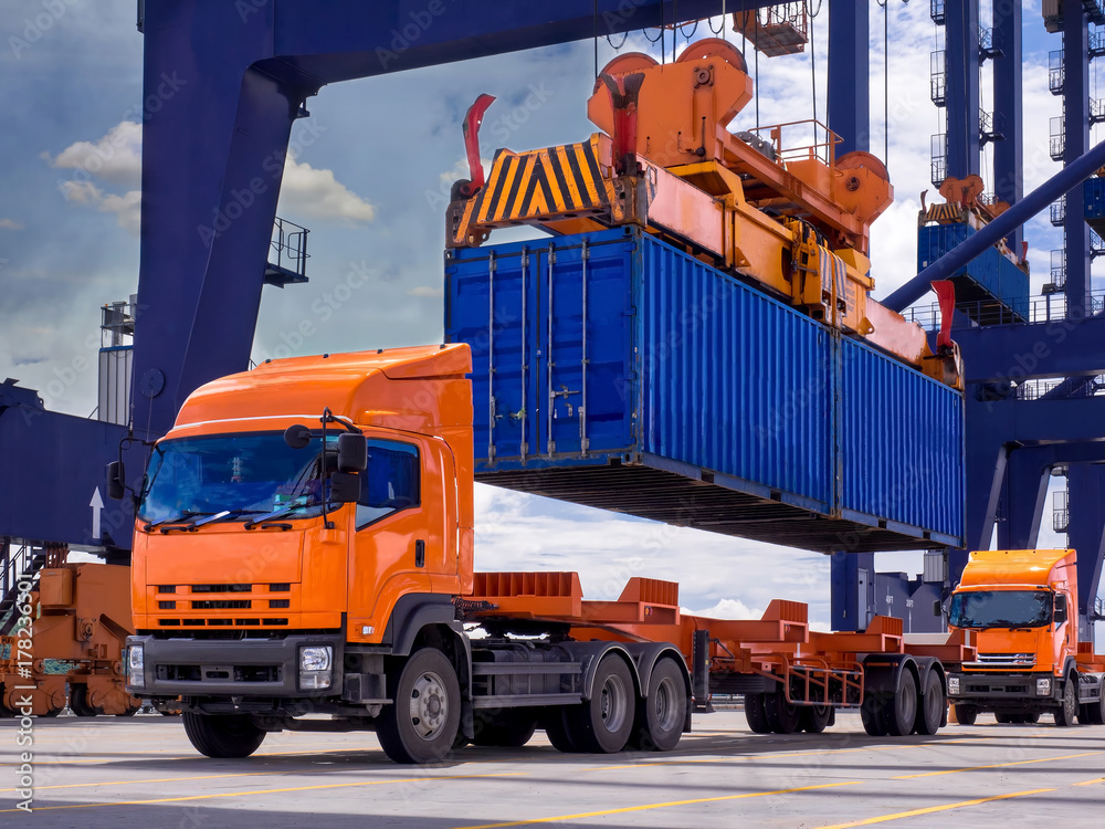 Industrial port crane lift up loading export containers box onboard ...