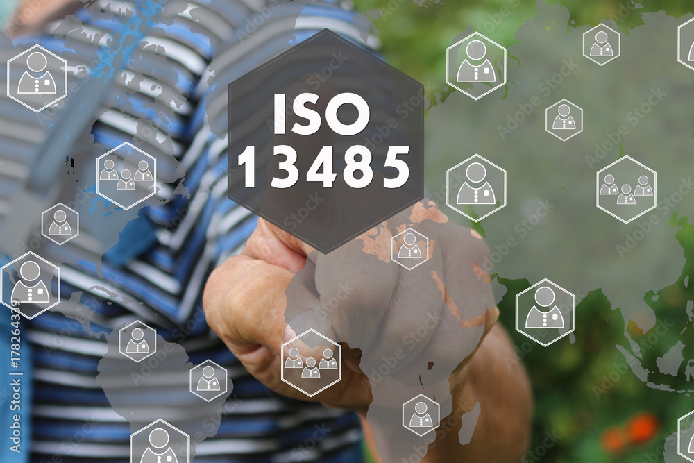 The businessman is choosing ISO 13485 touch on the world map ...