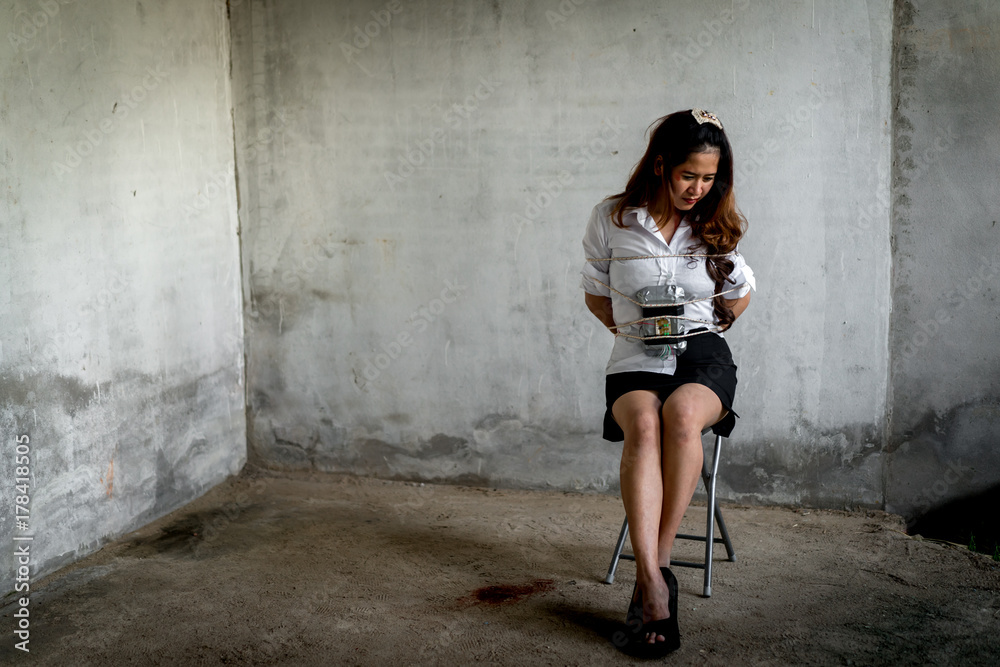 Foto de Stock Business woman tied with rope hostage with bomb concept or female kidnapped from ...