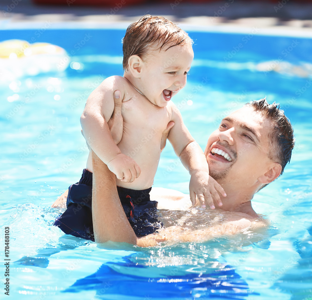 Стоковое фото «Child swimming lesson. Cute little boy learning to swim ...