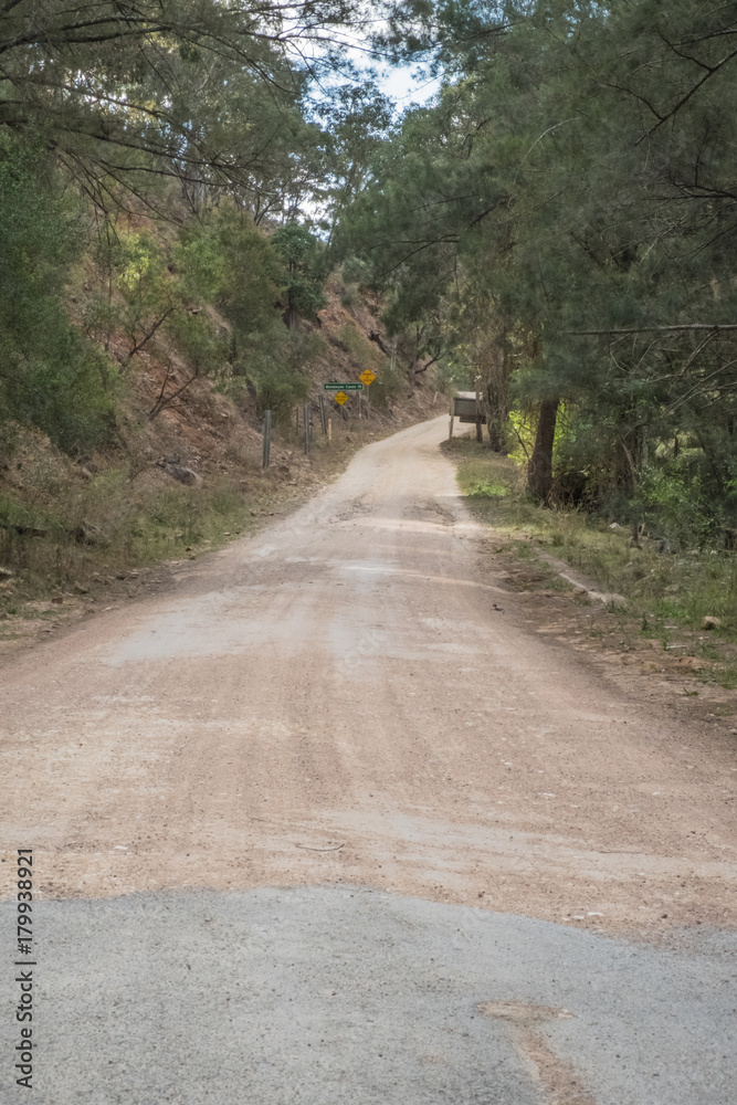 Wombeyan Caves Road transitioning from a sealed to an unsealed road ...