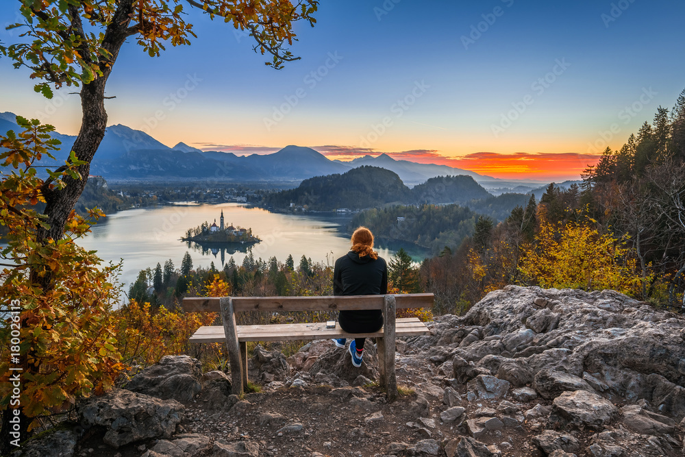 Bled, Slovenia - Red hair runner woman enjoying the beautiful autumn ...