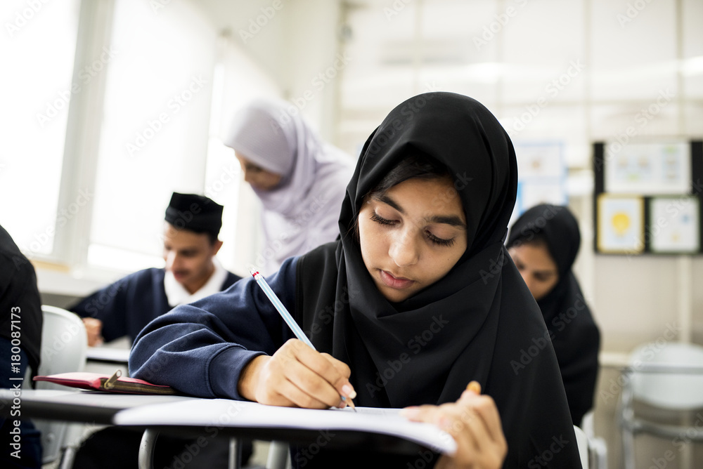 diverse muslim children studying in classroom Stock Photo | Adobe Stock