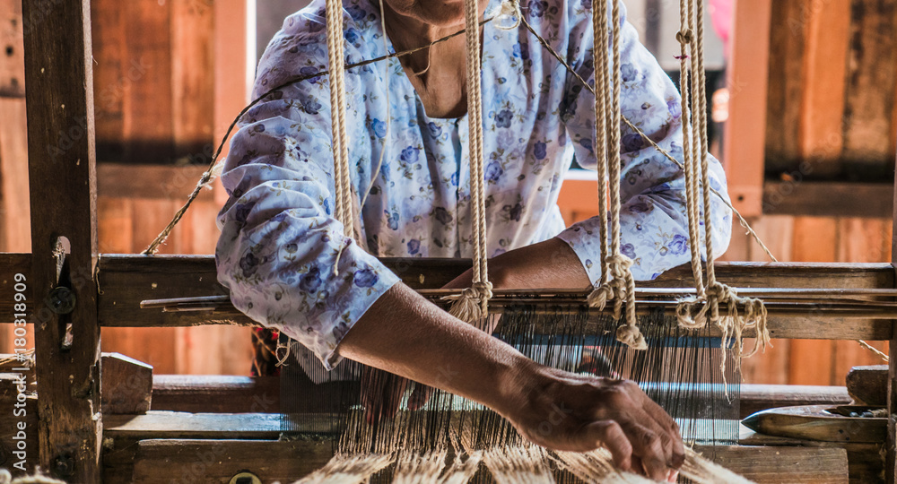 The local Intha woman weaving the lotus cloth with the hand loom at the ...