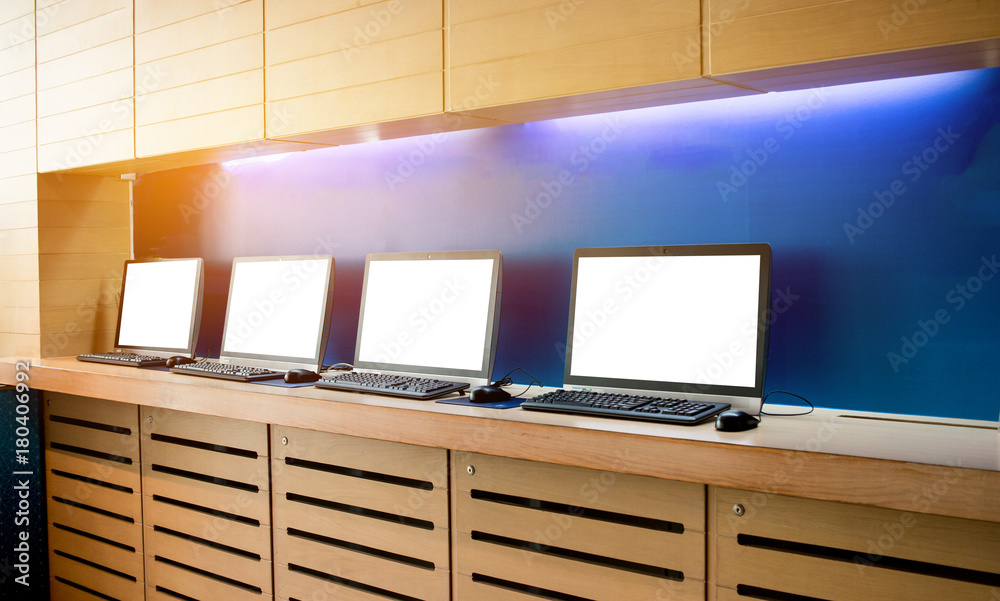 Internet cafe interior with computer blank screen on wooden table counter free service in airport. Internet cafe also known cybercafe is place which provides Internet access to public usually for fee ...