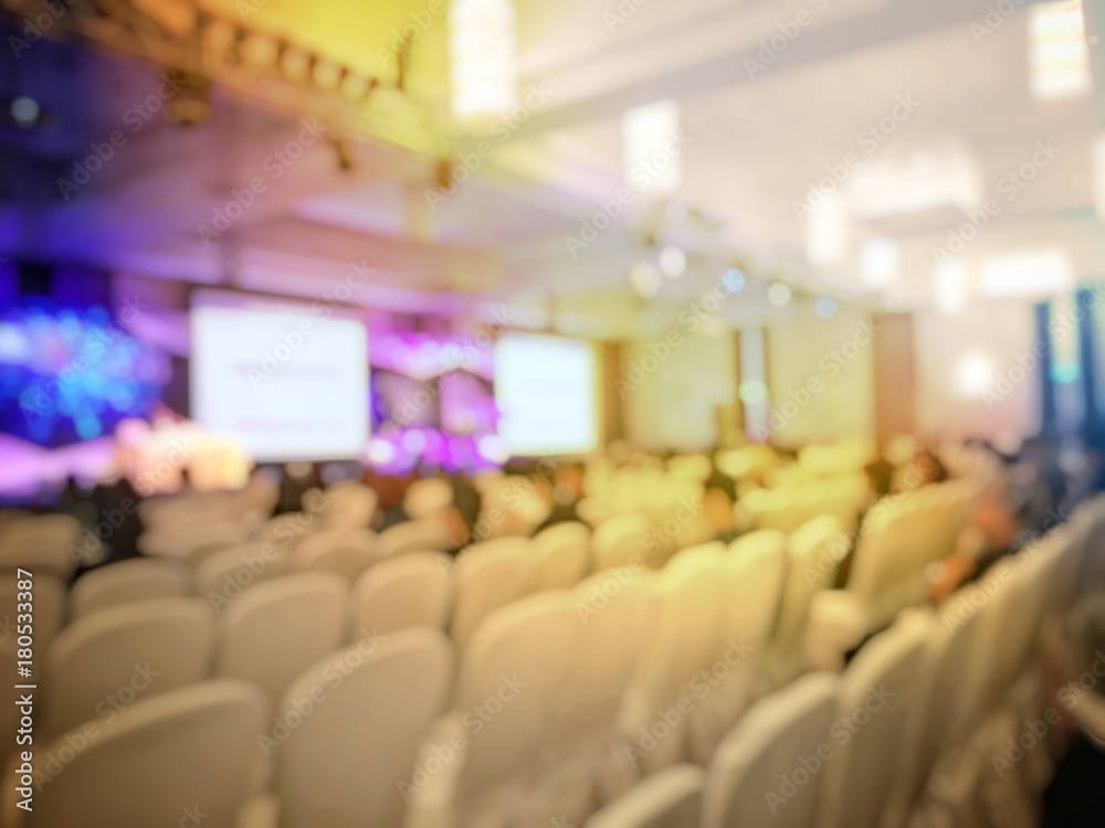 Abstract blurred image of people sitting in conference room for ...