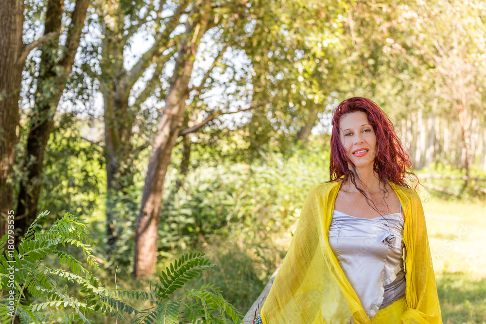 German mature woman in a green garden Stock Photo | Adobe Stock