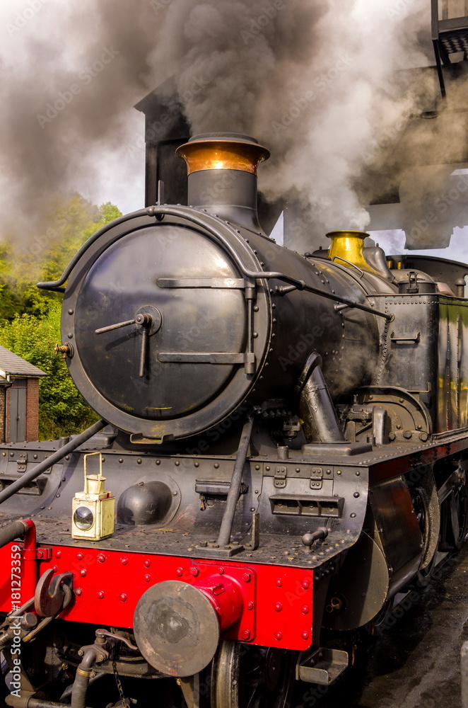 Steam Engine. Heritage steam engine in steam, waiting under the coal ...