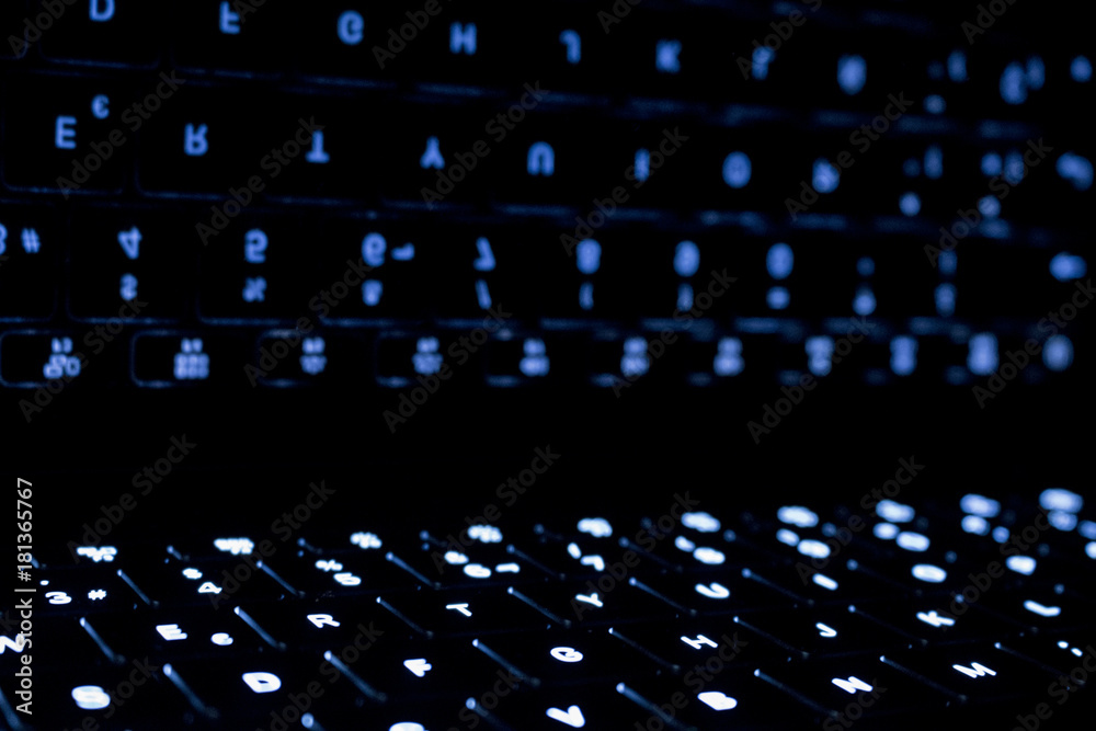 Foto de Stock Computer keyboard lighting with reflection on the screen ...