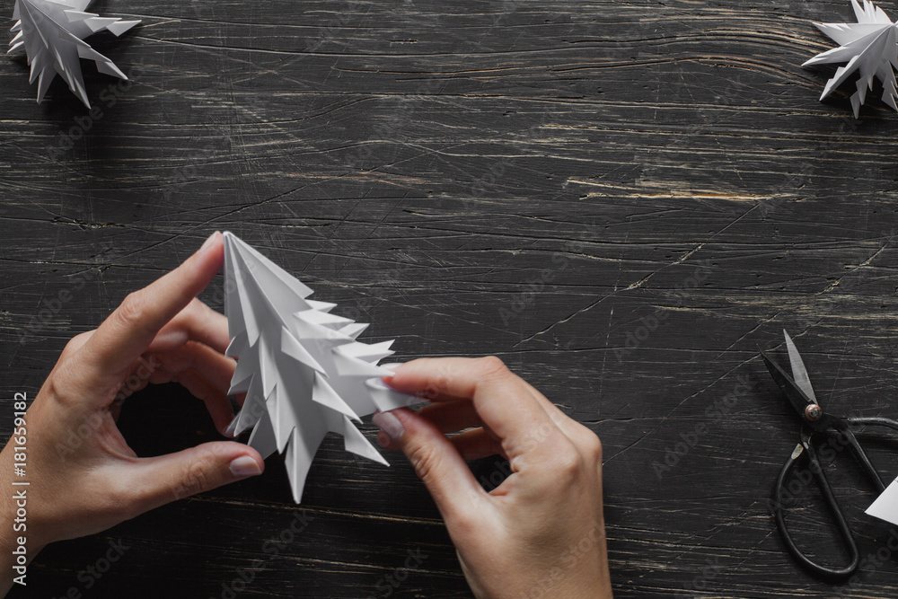 Origami Christmas tree making. Step by step, tutorial with hands Stock ...