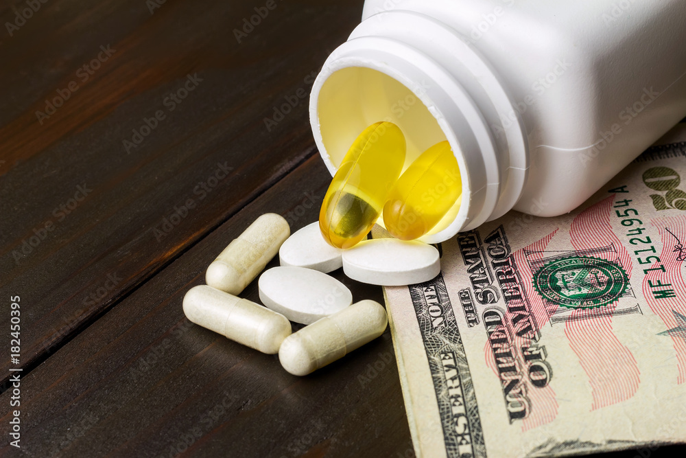 Yellow capsules of omega-3 in bottle, white capsules of glucosamine ...