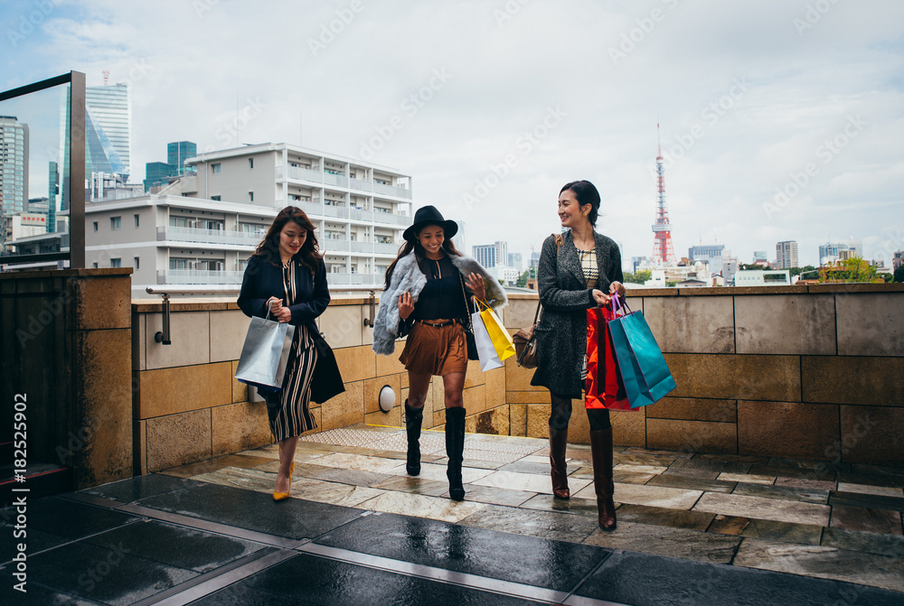 Group of japanese women spending time in Tokyo, making shopping in ...
