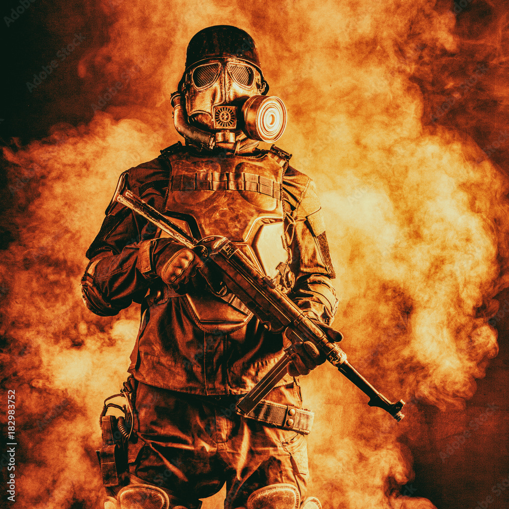 Futuristic nazi soldier in fire and smoke gas mask and steel helmet ...