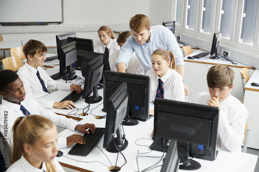 Teenage Students Wearing Uniform Studying In IT Class Stock Photo ...