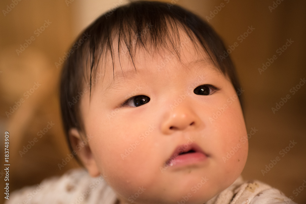 Baby face looking up in the up close / A Japanese girl who is 11 months ...