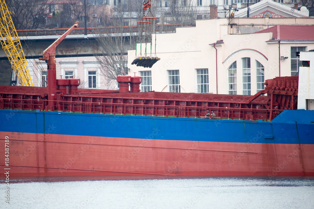 Vessel dry cargo on loading, unloading in port. Bulker in port. port ...