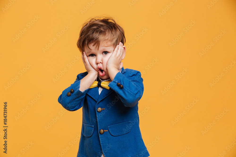 Shocked screaming boy child standing isolated Stock Photo | Adobe Stock