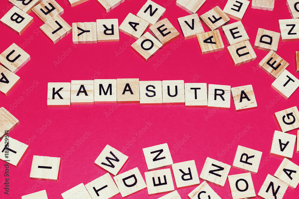 Wooden blocks on a red background spelling words Kamasutra Stock Photo ...
