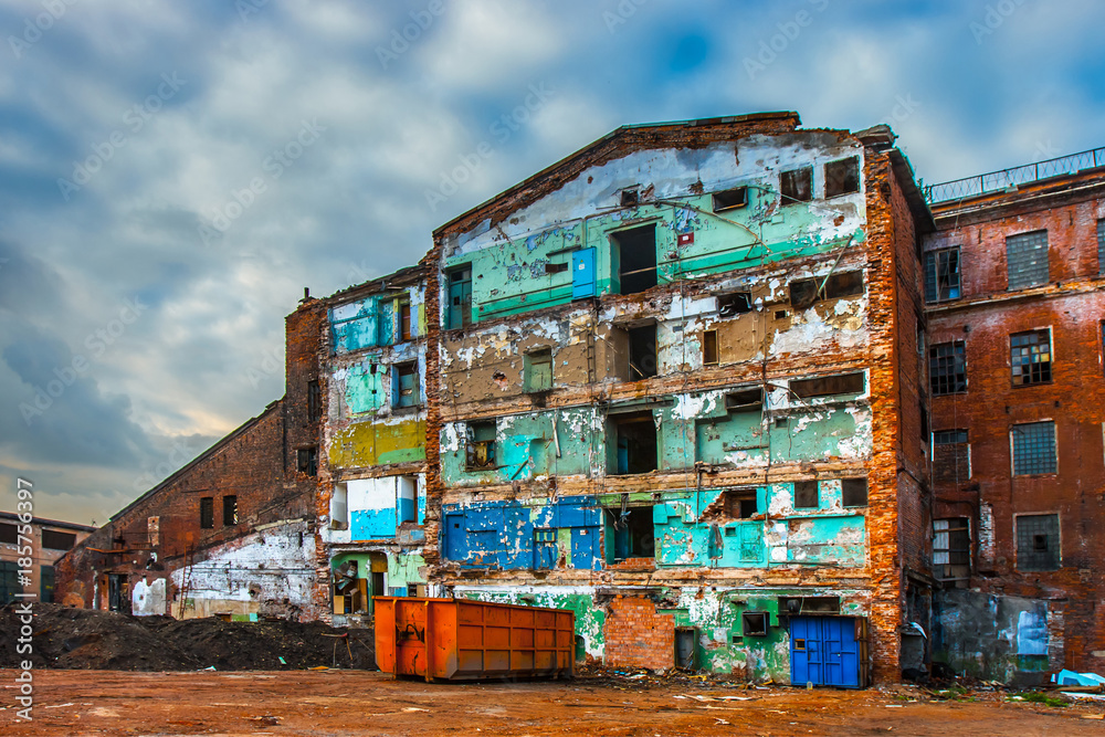 The demolished house is half-way. Demolition of houses. Reconstruction ...