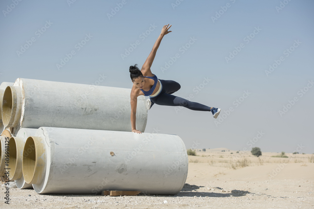 Black African Amercian athletic woman jumps over and leaps from ...