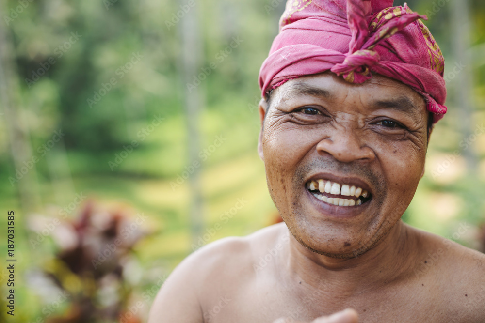 Happy Balinese man in traditional clothing Stock Photo | Adobe Stock