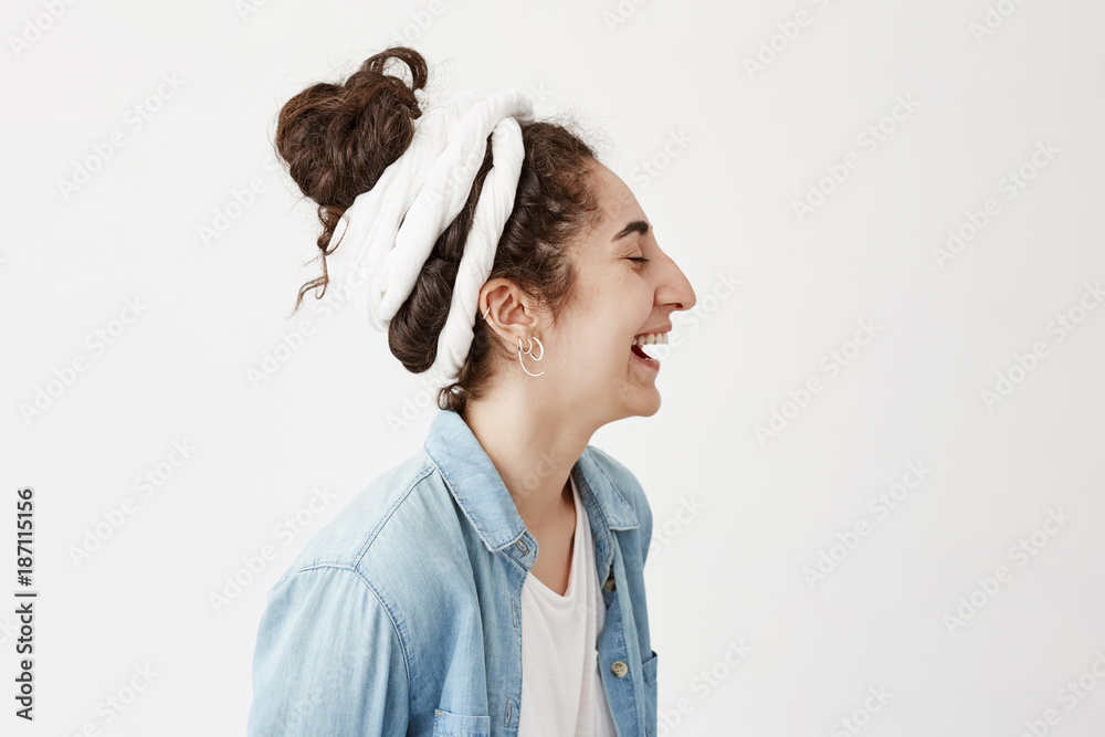 Profile of girl with dark and wavy hair in do-rag having good mood ...