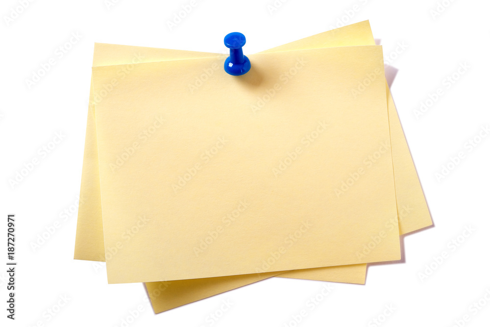 Several pile stack yellow oblong sticky post it note with pin pushpin ...