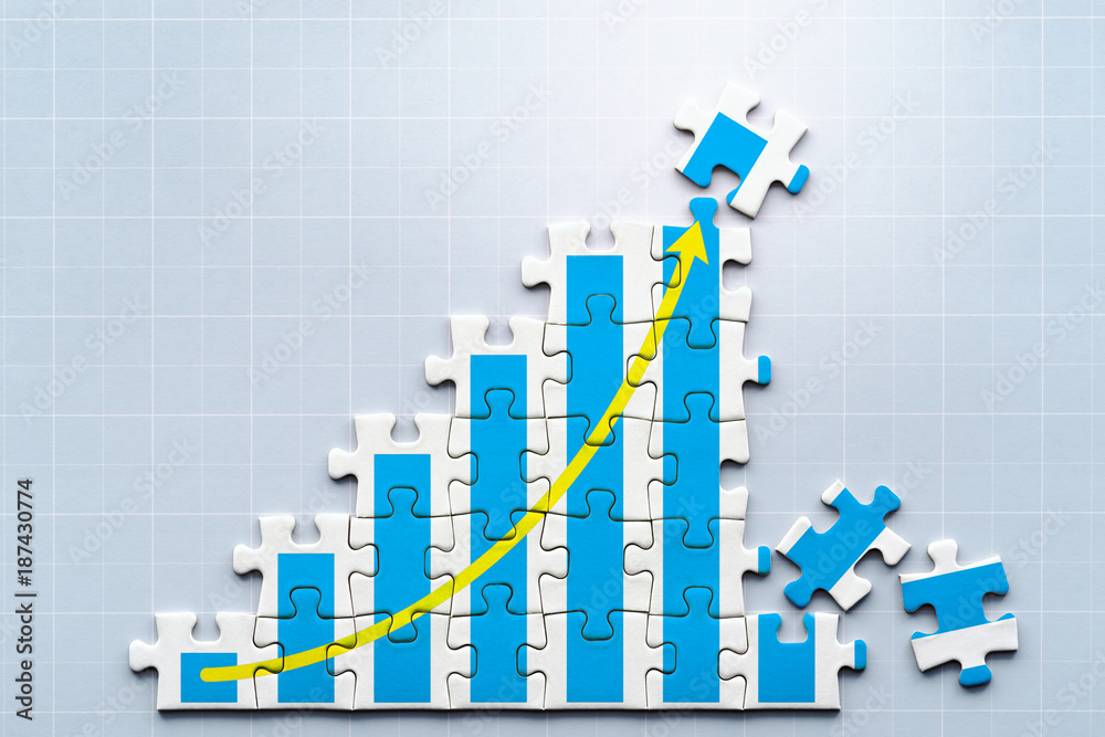 Creation of growth. Growth chart drawn on puzzle. Working on puzzle ...