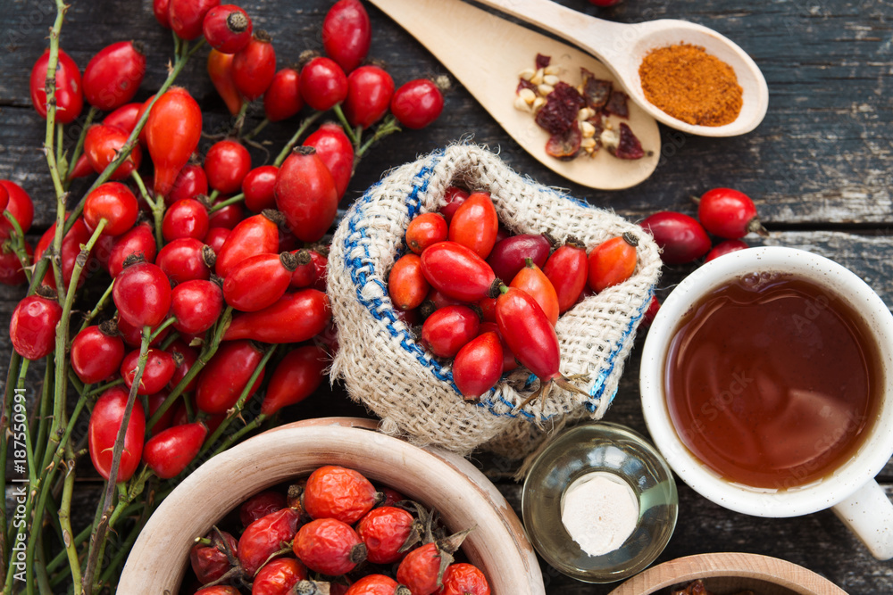 cup of herbal Dog rose tea with bunch branch Rosehips, types Rosa ...