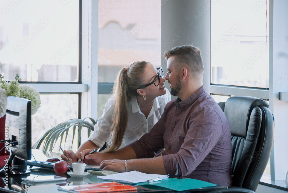 Love affair at work. Secretary kiss her boss. Beautiful girl being in ...