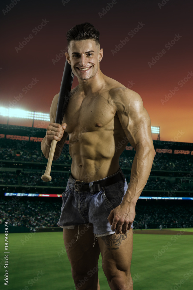 Cheerful handsome shirtless man with baseball bat posing on stadium ...