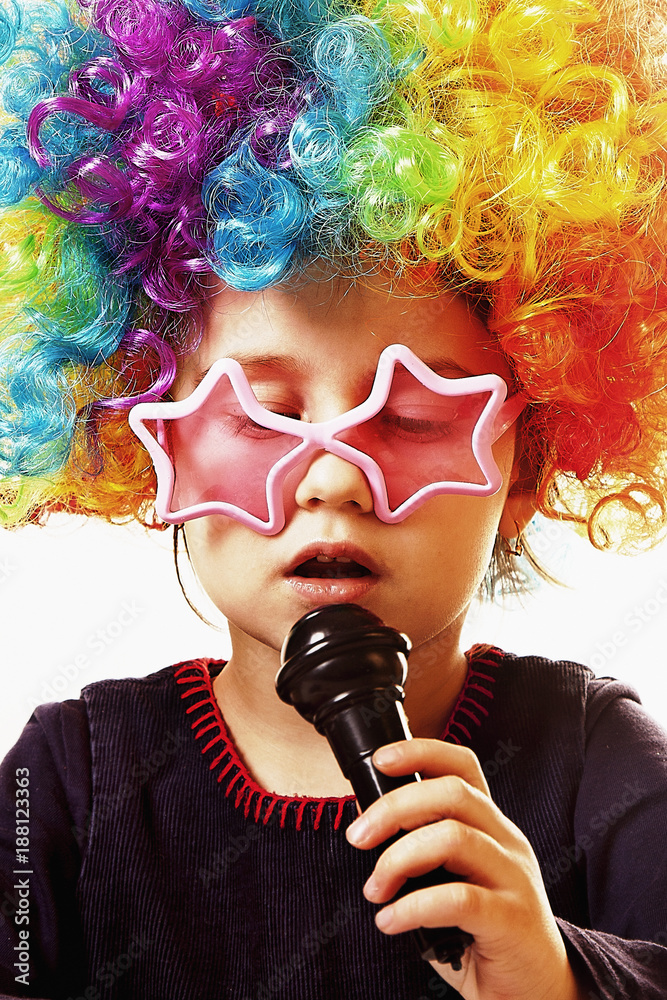 The famous actress. Humorous photocute child girl singing with a ...