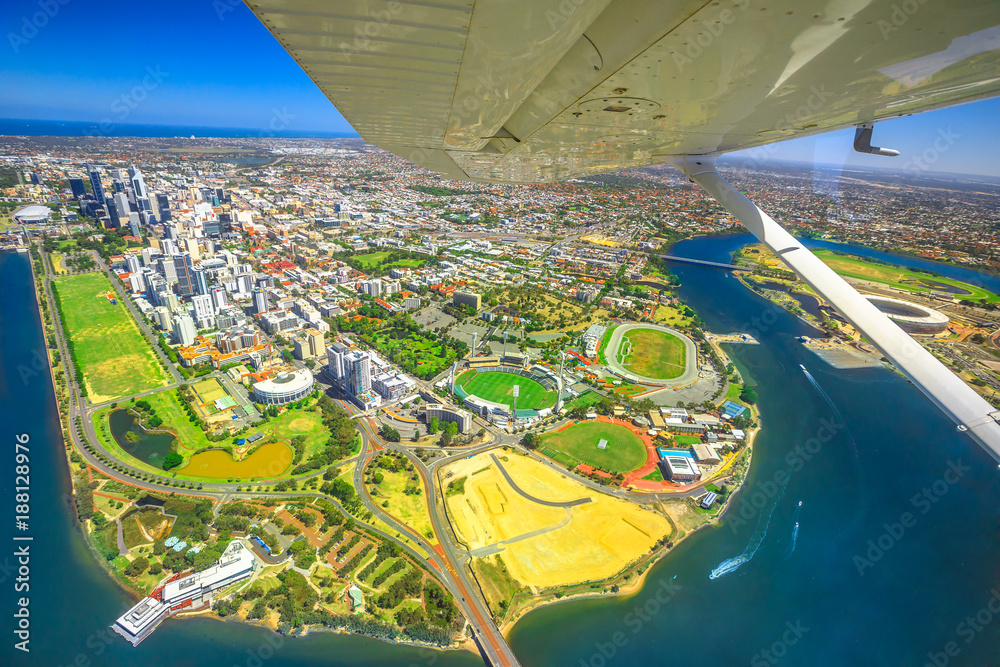 Aerial view of Perth Skyline in Australia. Scenic flight with wing of ...