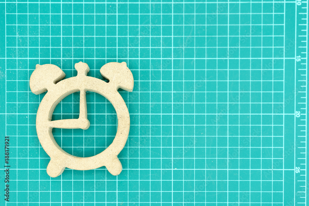 Wooden clock model put cutting mat background, business, meeting, ideas ...